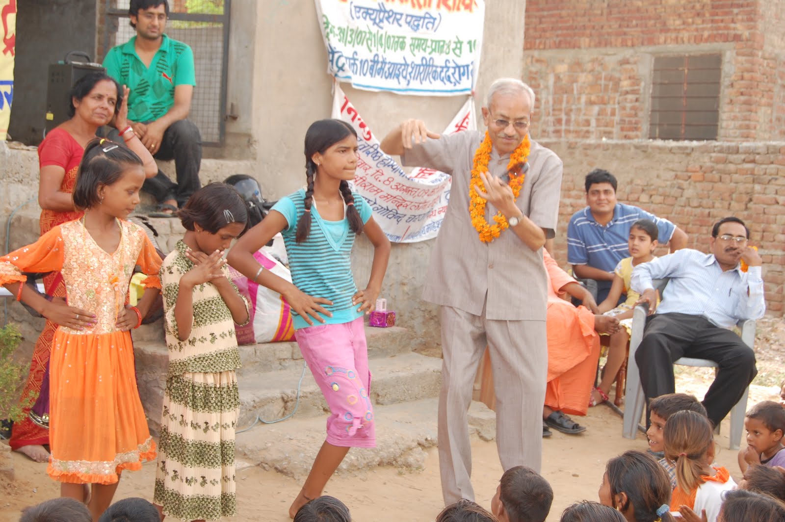 Educating the poor Children: Distributing clothes to the children ...