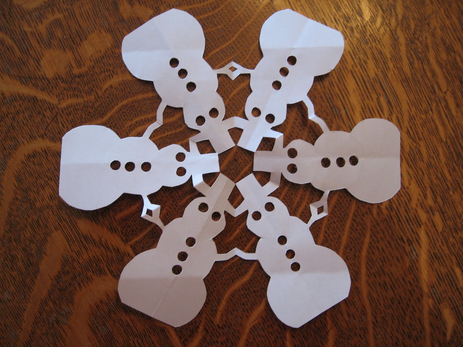 Almost Unschoolers: Snowflake Paper Dolls and a Snowman Mosaic