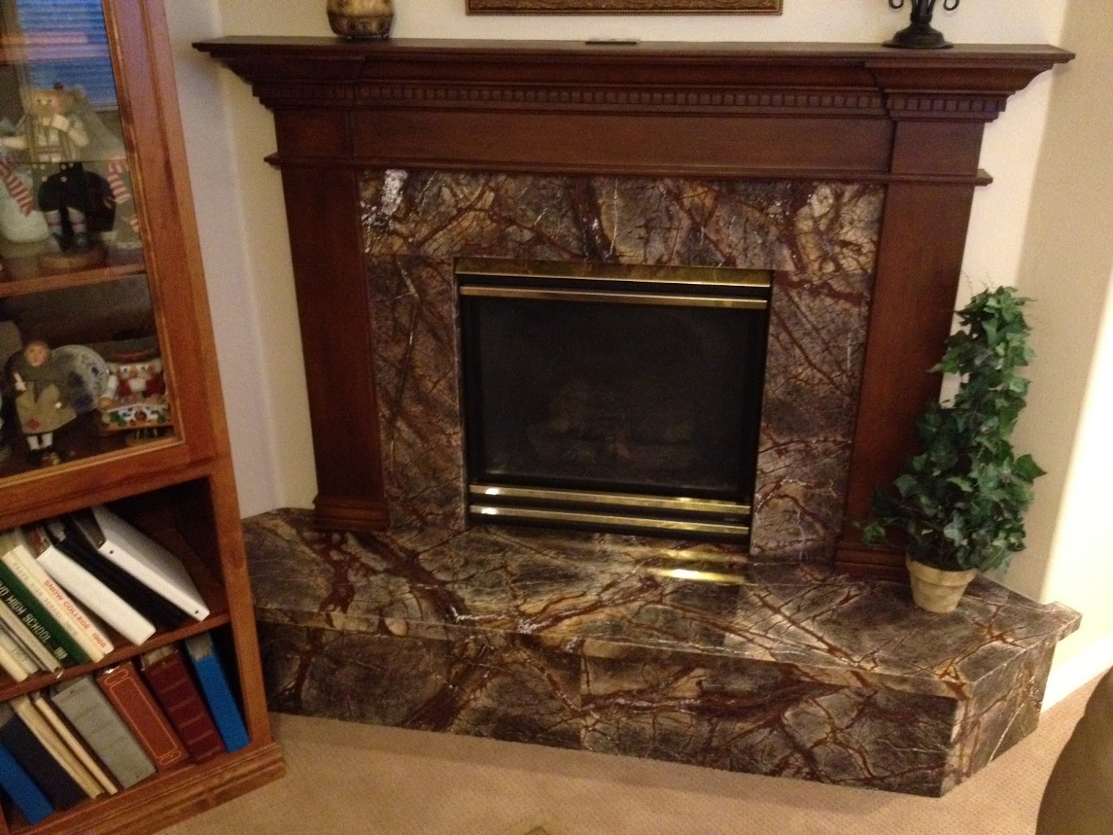 The Granite Gurus: Rain Forest Brown Fireplace by MGS by Design