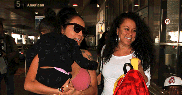 Chris Brown's mum, baby mama and daughter pictured at the airport (photos)