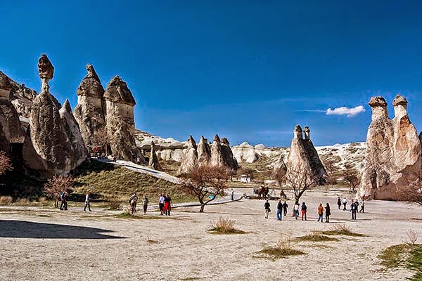 First, we drove to Ç avu ş in and saw some old buildings andcaves cut ...