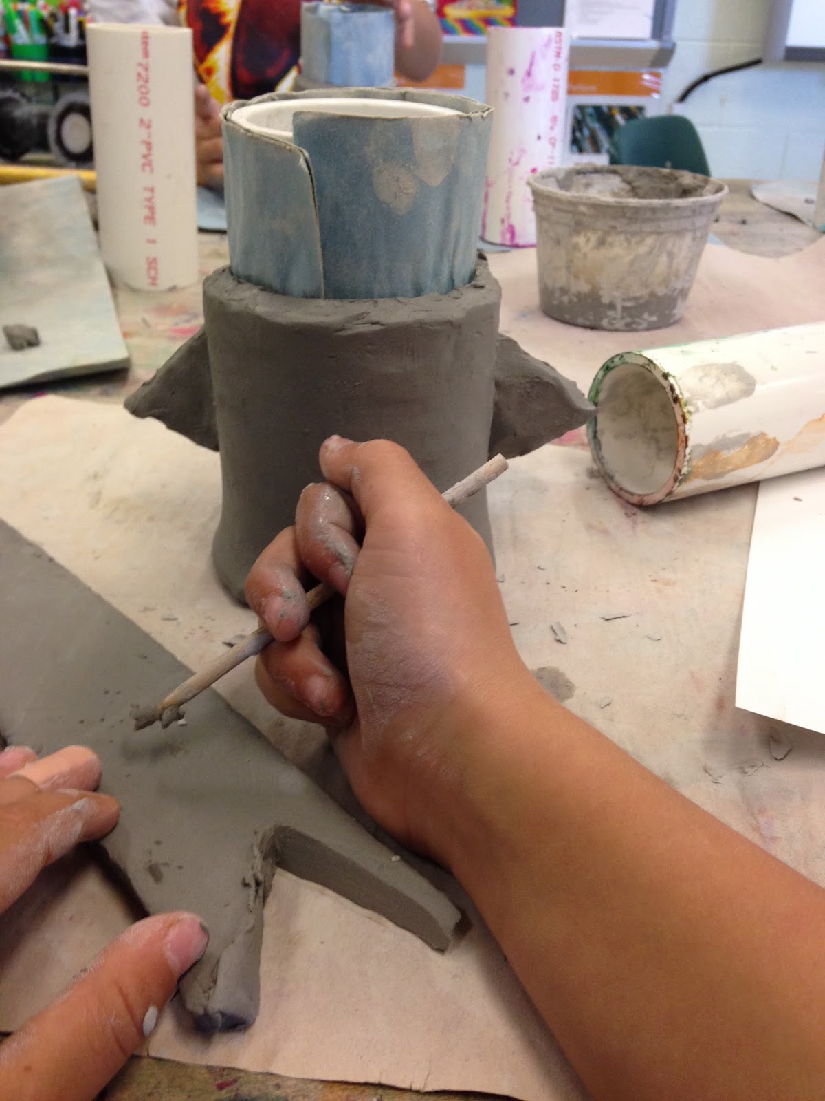 Art Room Blog: Totem Poles in Clay 2nd Grade Project...