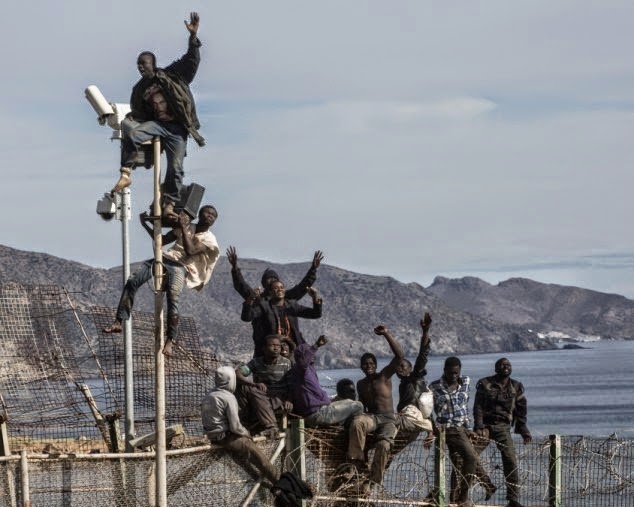 Susan Ibie Blog: Sad:African Immigrants Desperately Cling Onto Border ...