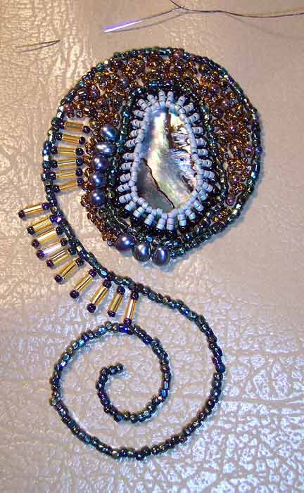 Bead embroidered paua shell centerpiece