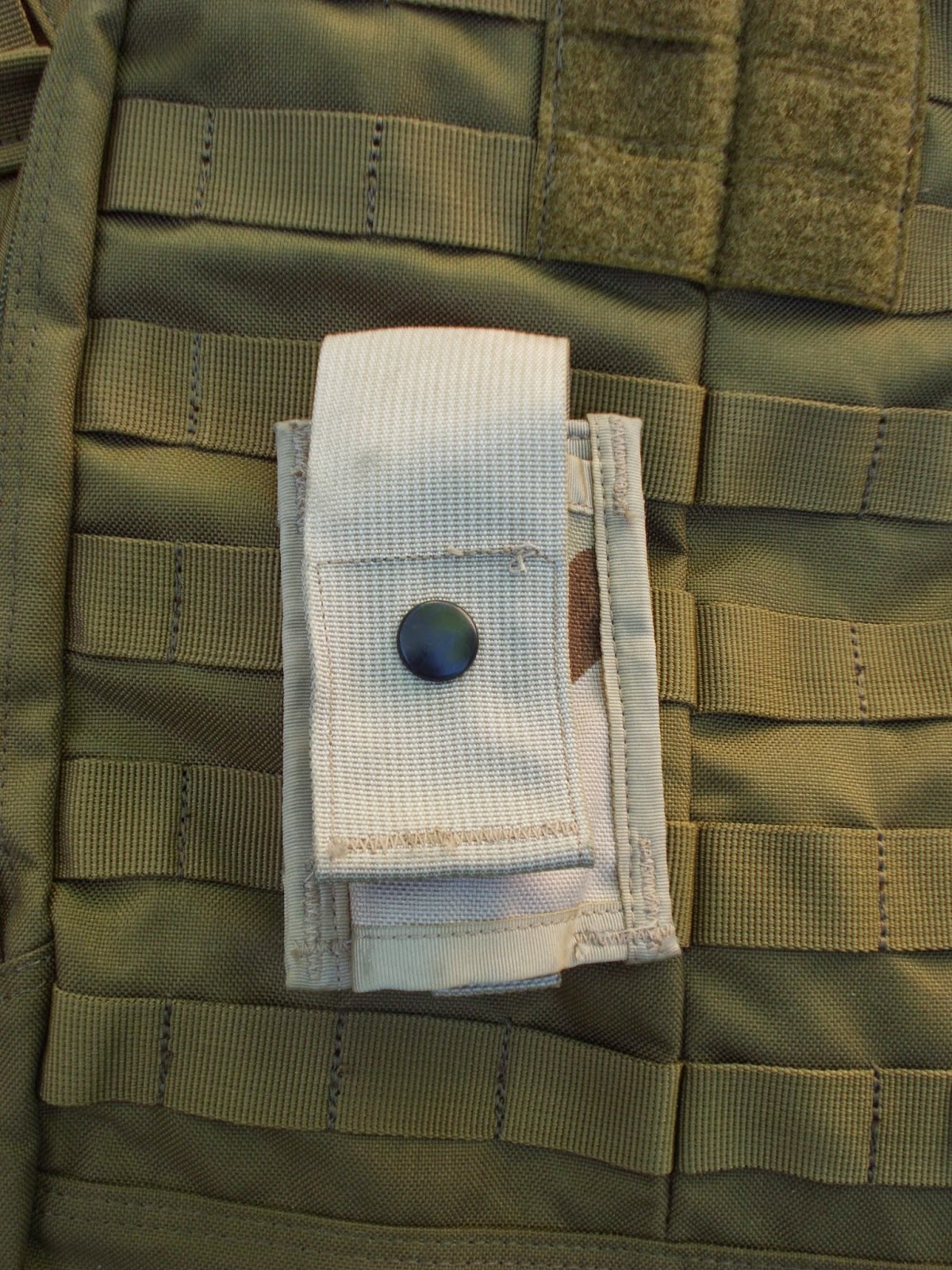 The Tactical Outdoorsman: How to carry a hatchet on a MOLLE pack.