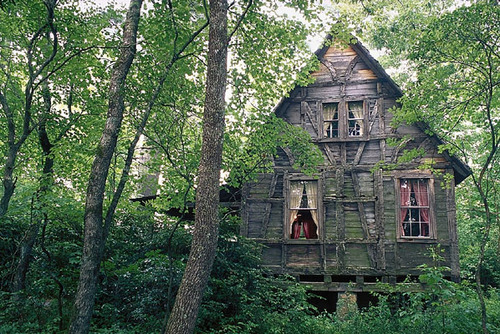 Waiting in the shade sitting on a brick ...: A typical backwoods house ...