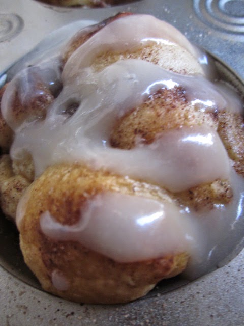 While the cinnamelts are still warm in the pan, they get a generous ...