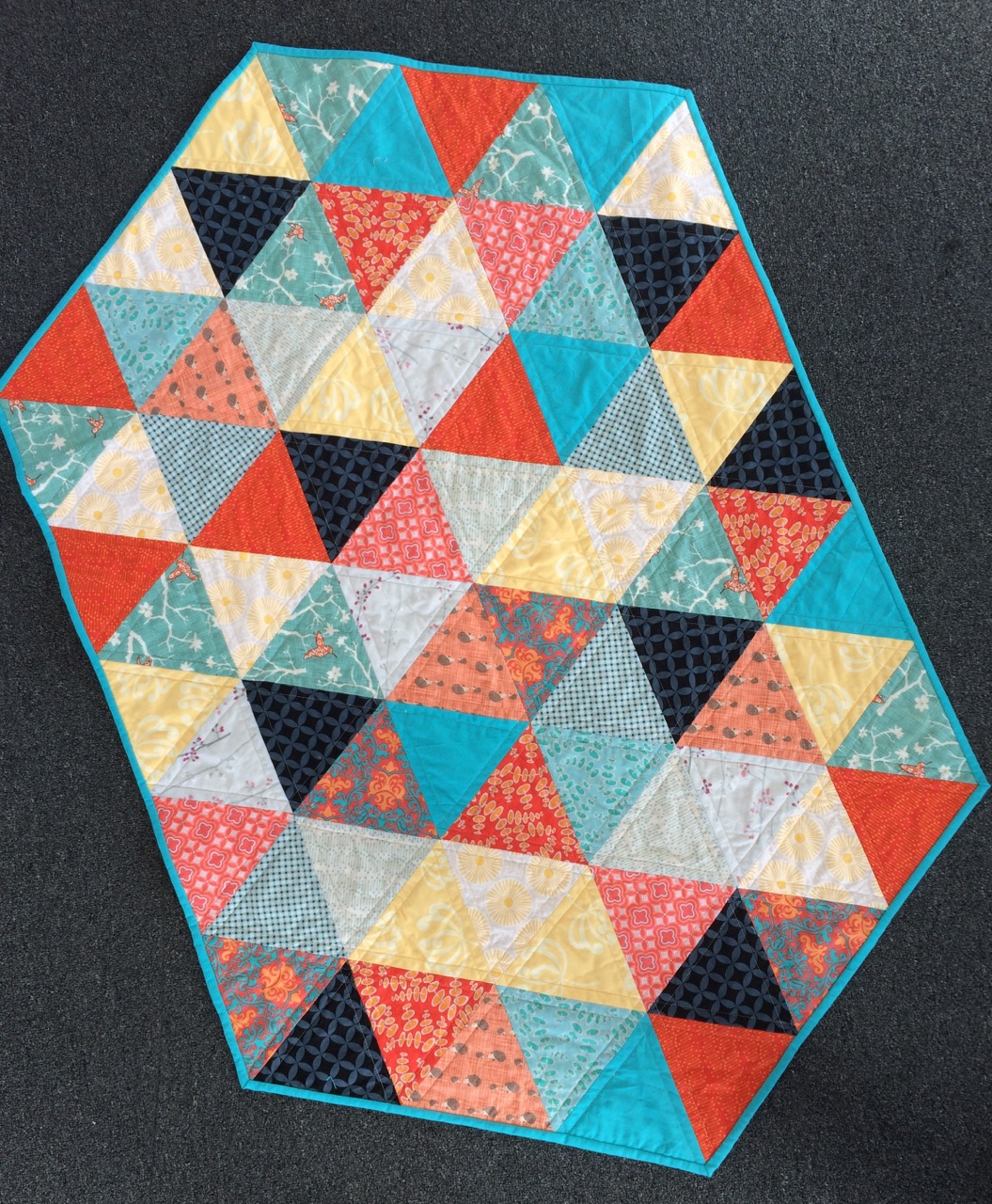 Charlotte Scott - Textile Artist: How to bind a funny angled quilt.