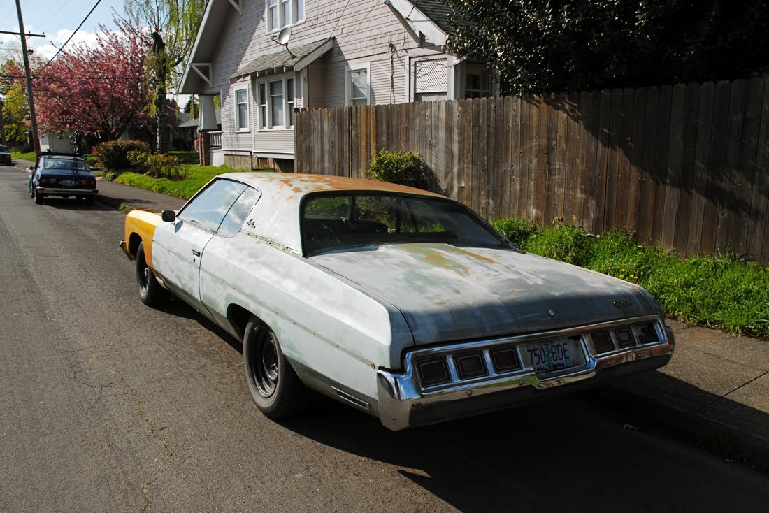 OLD PARKED CARS.: 1973 Chevy Impala Custom.