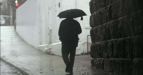 Man Alone In Rain