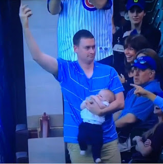the other paper: Cubs fan holding baby interferes with foul ball at ...