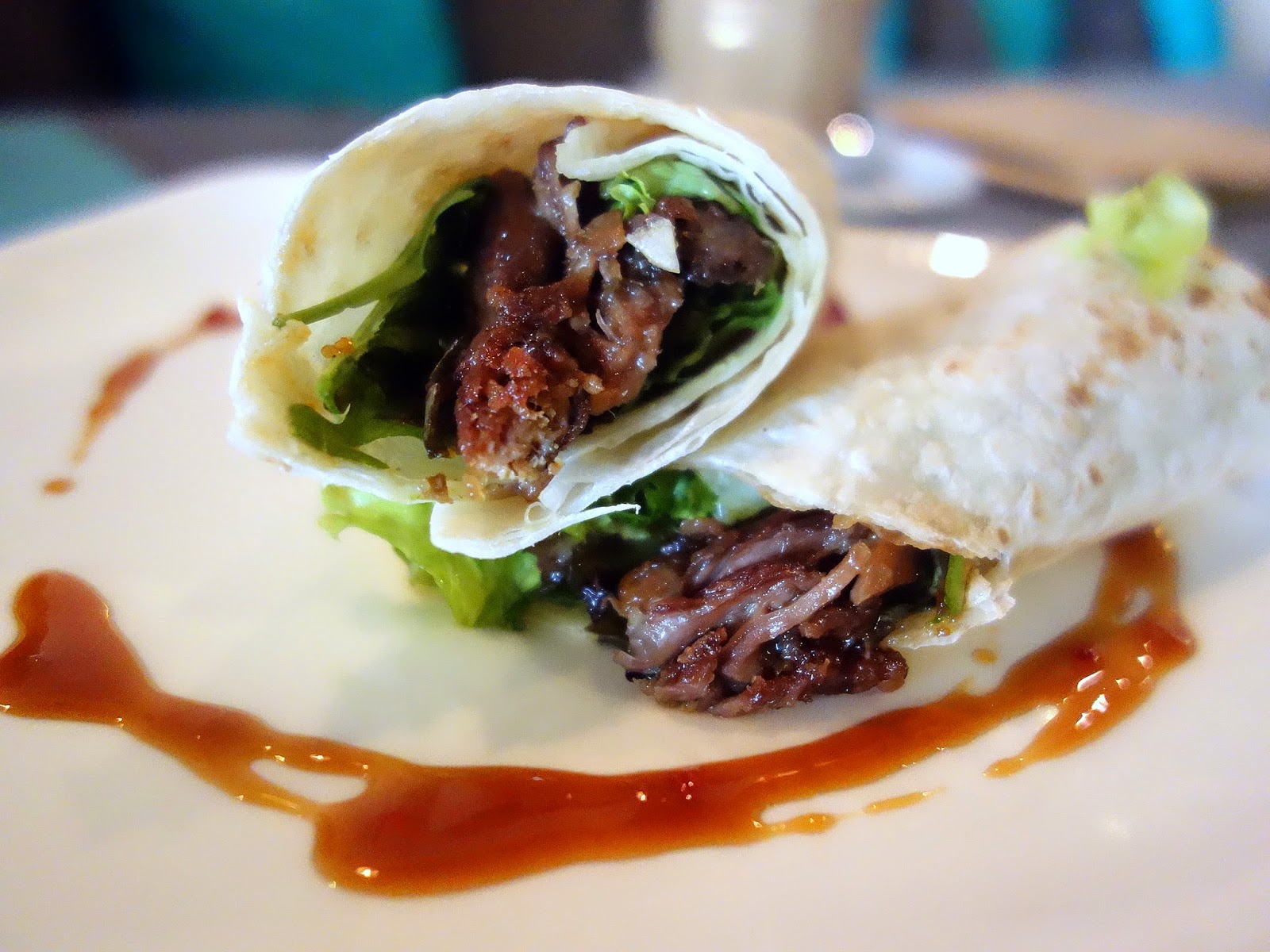 Another enjoyable appetiser: Roast duck burritos (RM8.90), stuffed with ...