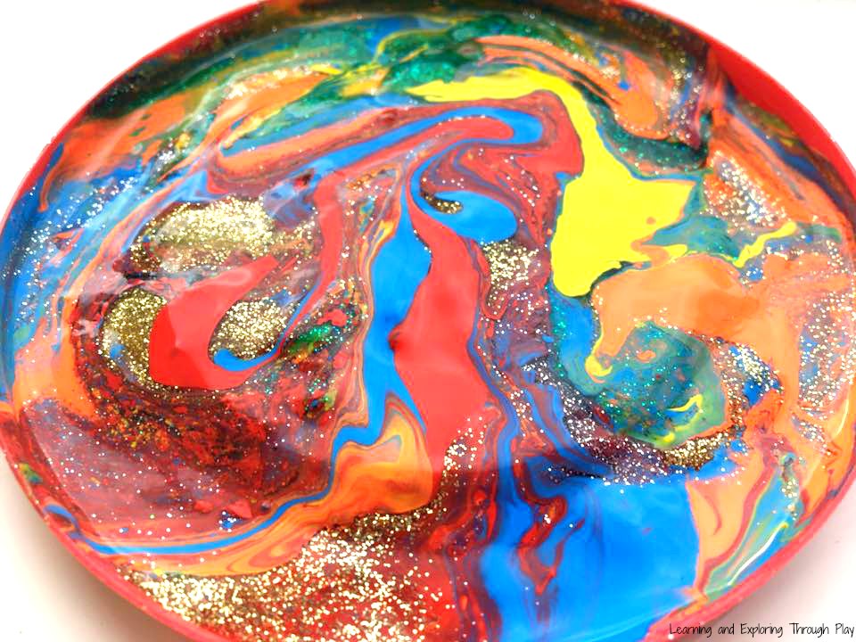 Learning and Exploring Through Play: Marbled Lids Process Art