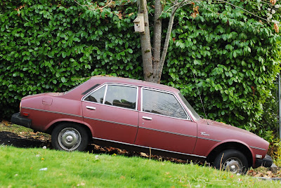 OLD PARKED CARS.: 1978 and 1979 Peugeot 504 Diesel Sedans.