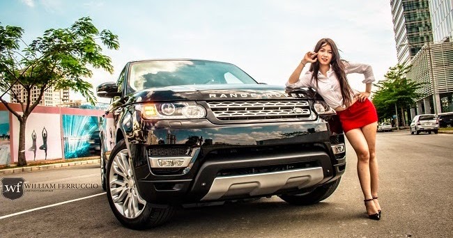 Rebellion office girl poses with Range Rover Sport | Carsfresh
