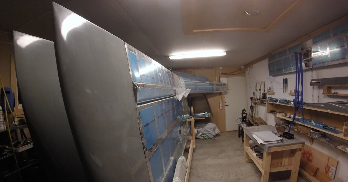 The building of a Vans RV-14: Wingtip ribs riveted, flaps reattached....