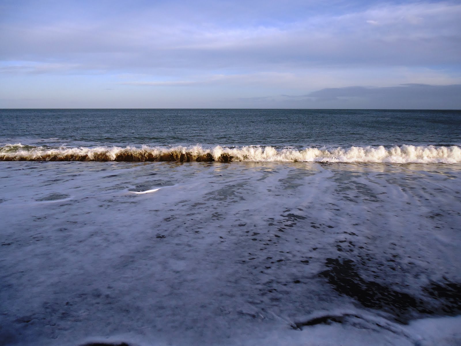 Patrick Comerford: A slow setting sun on the beach at Kilcoole