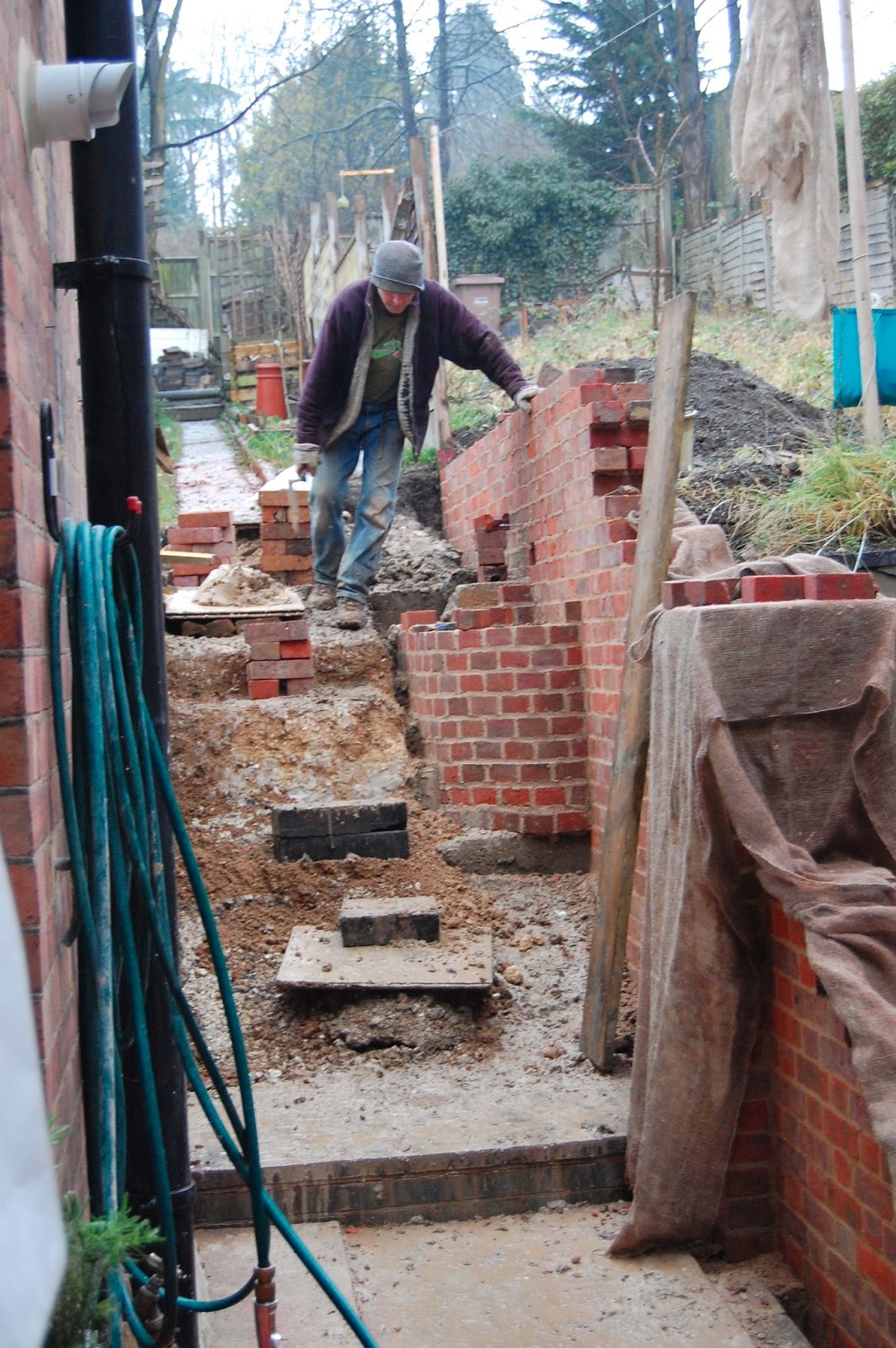 Higher brick piers and curved brick planters
