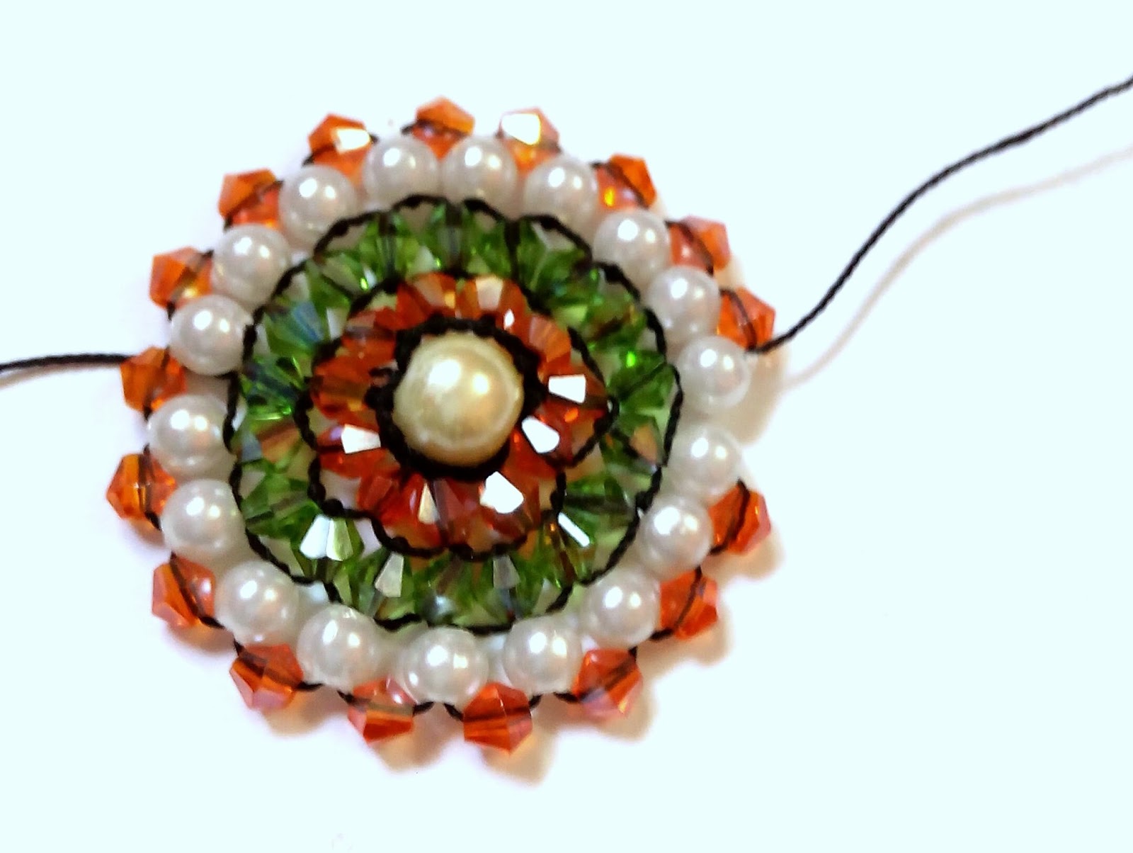 Beadination: Brick stitch around a bead