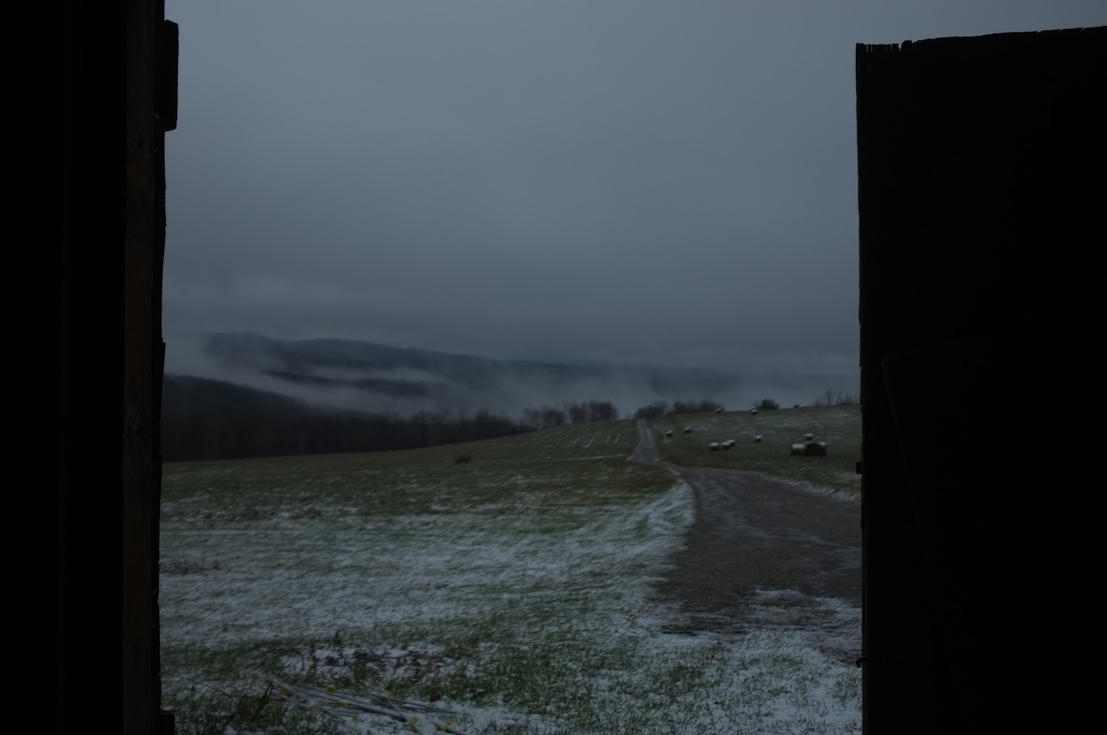 la porte rouge: snow falling outside and a thawing