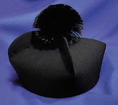 man with black hat: Behind the Biretta