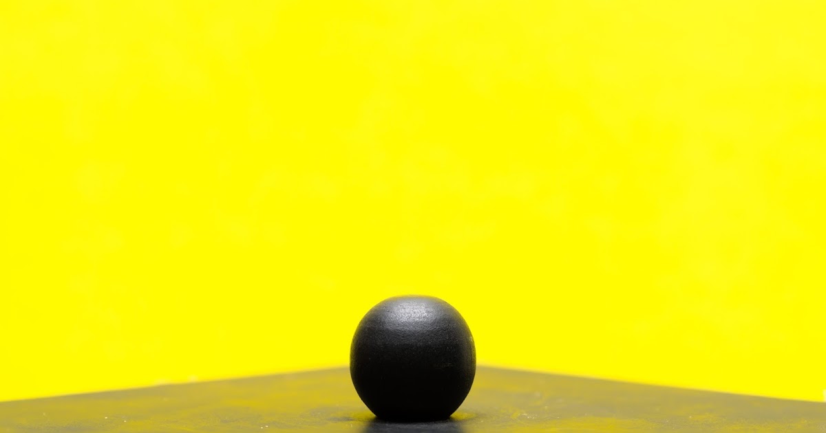 Yellow background with black circle
