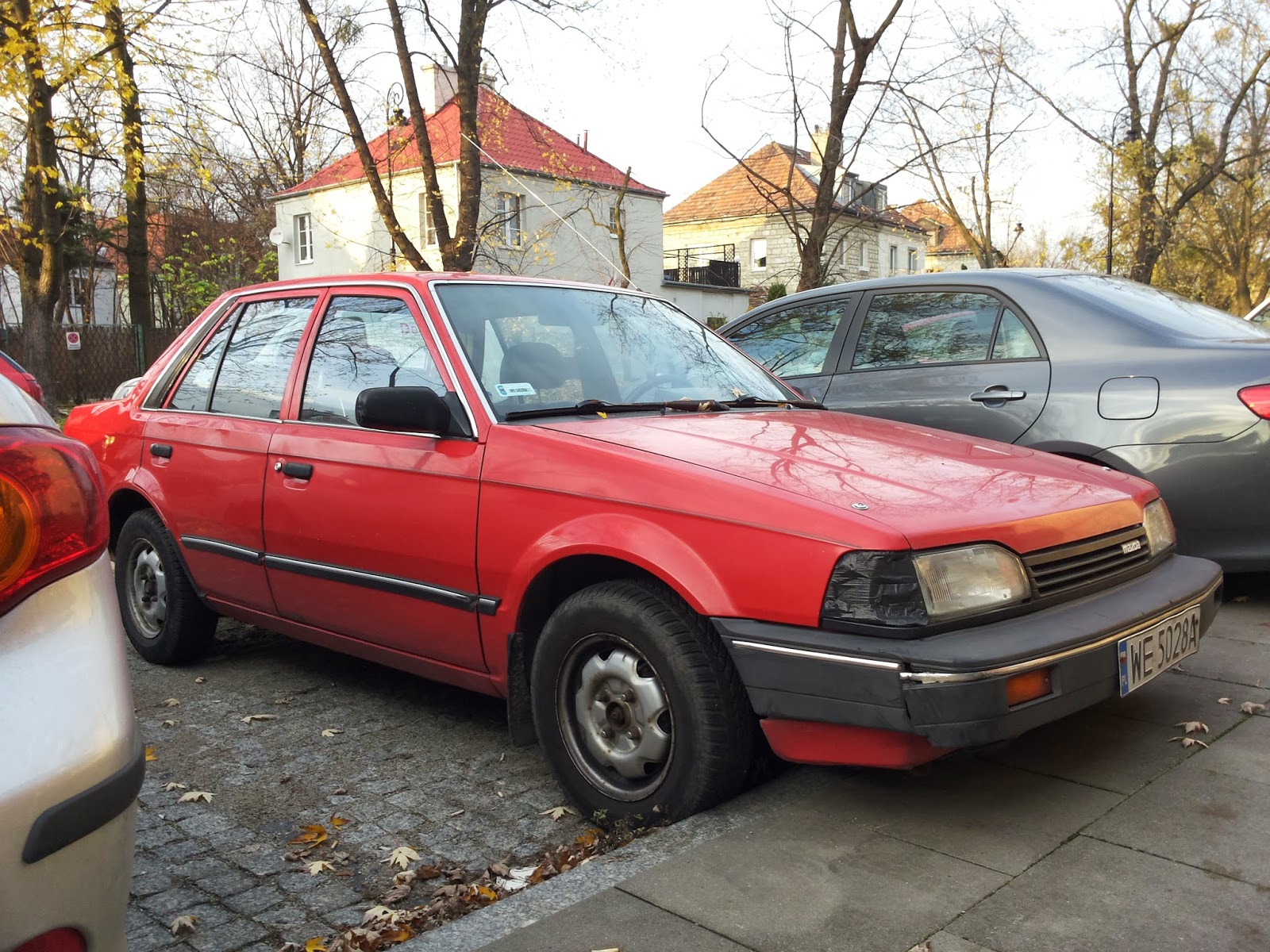 Old Parked Cars Warsaw: 1987 Mazda 323 BF Sedan