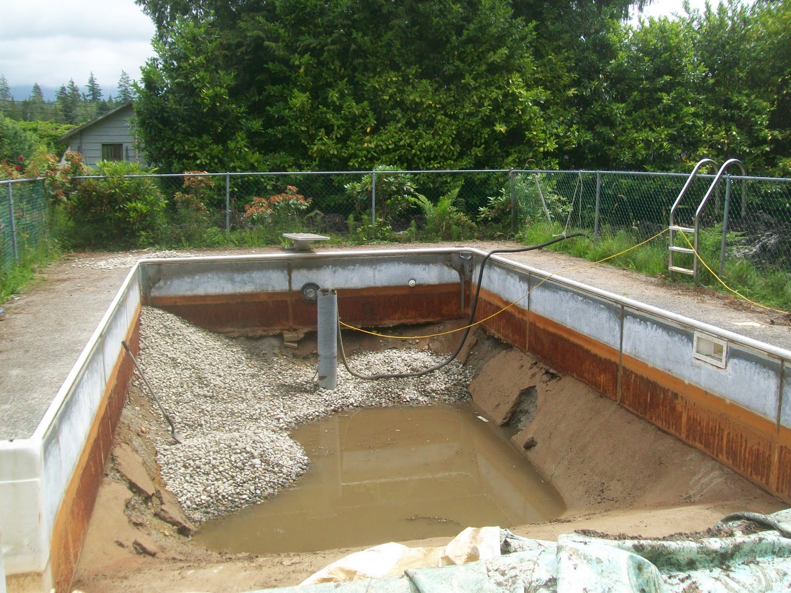 Solar Pit Greenhouse: From Green Swimming Pool to Greenhouse