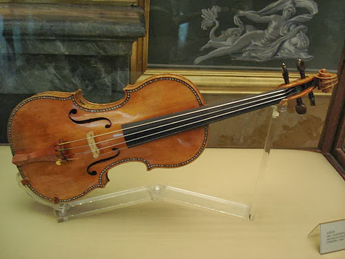 Book of Muses: He holds it in front of him like an instrument, a Suzuki ...