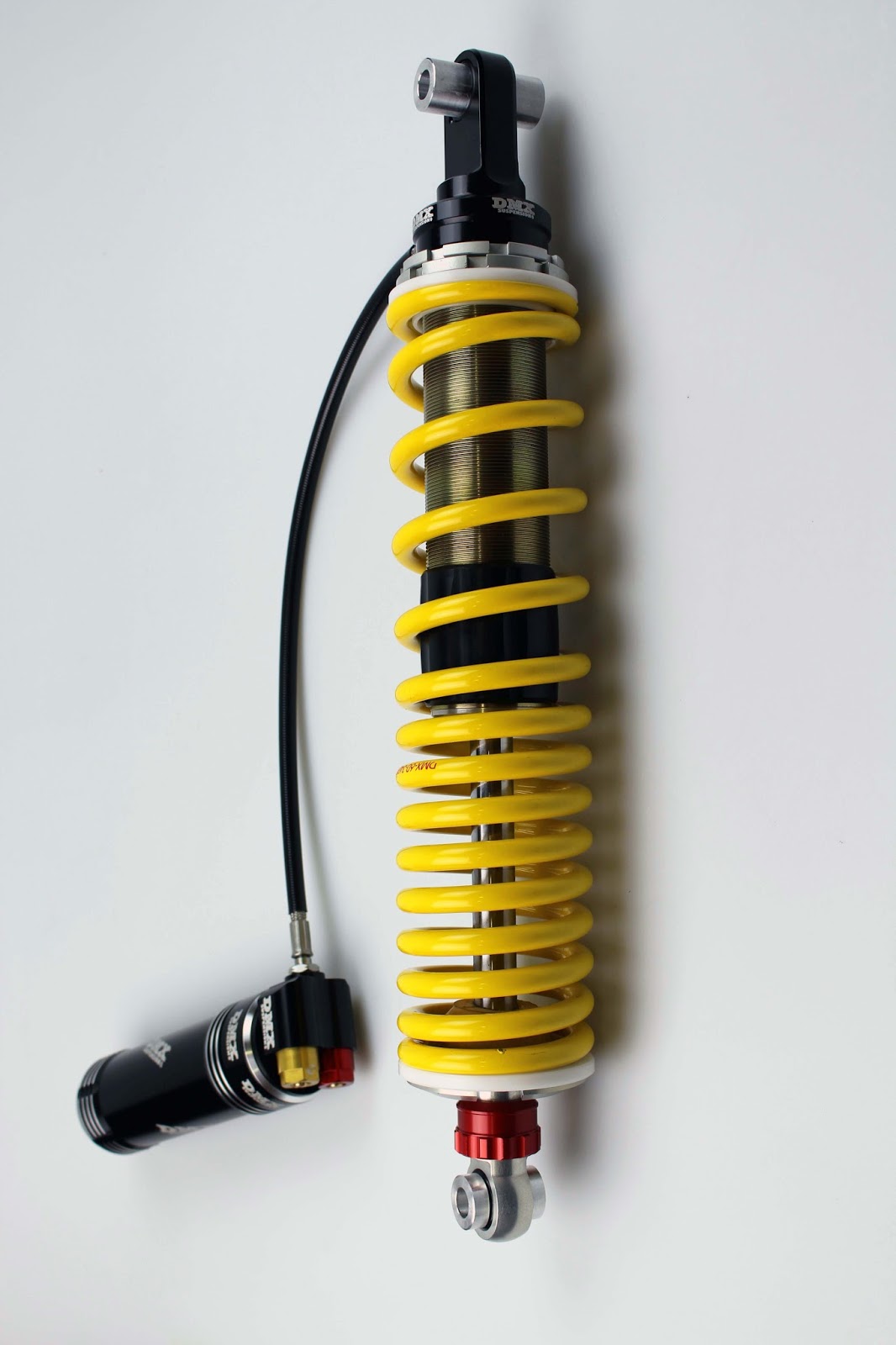 DMX SUSPENSION: Amortiguador DMX Car Cros doble regulación (Latiguillo)