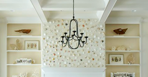 Shell Wall above Fireplace in an Elegant White Coastal Living Room