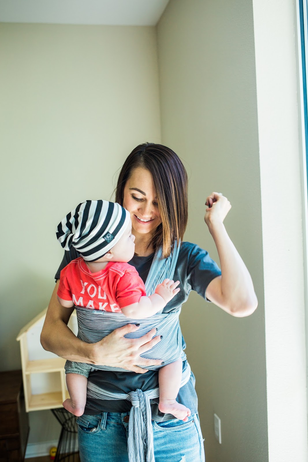 While keeping those froggy legs, pull it up and over baby's legs and ...