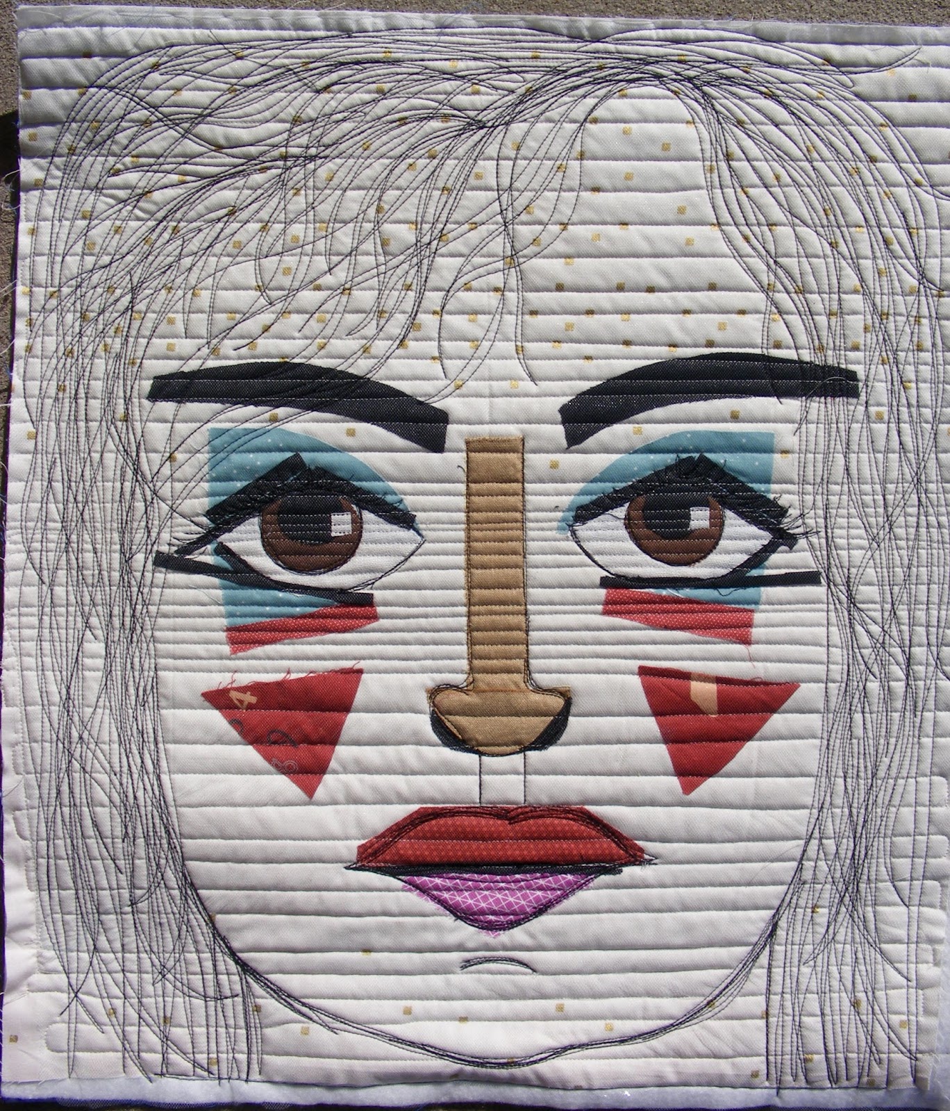 TIA CURTIS QUILTS: I have also been making faces.