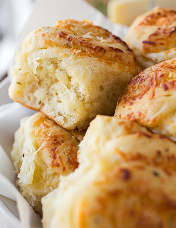 Light and fluffy dinner rolls are infused with fresh rosemary
