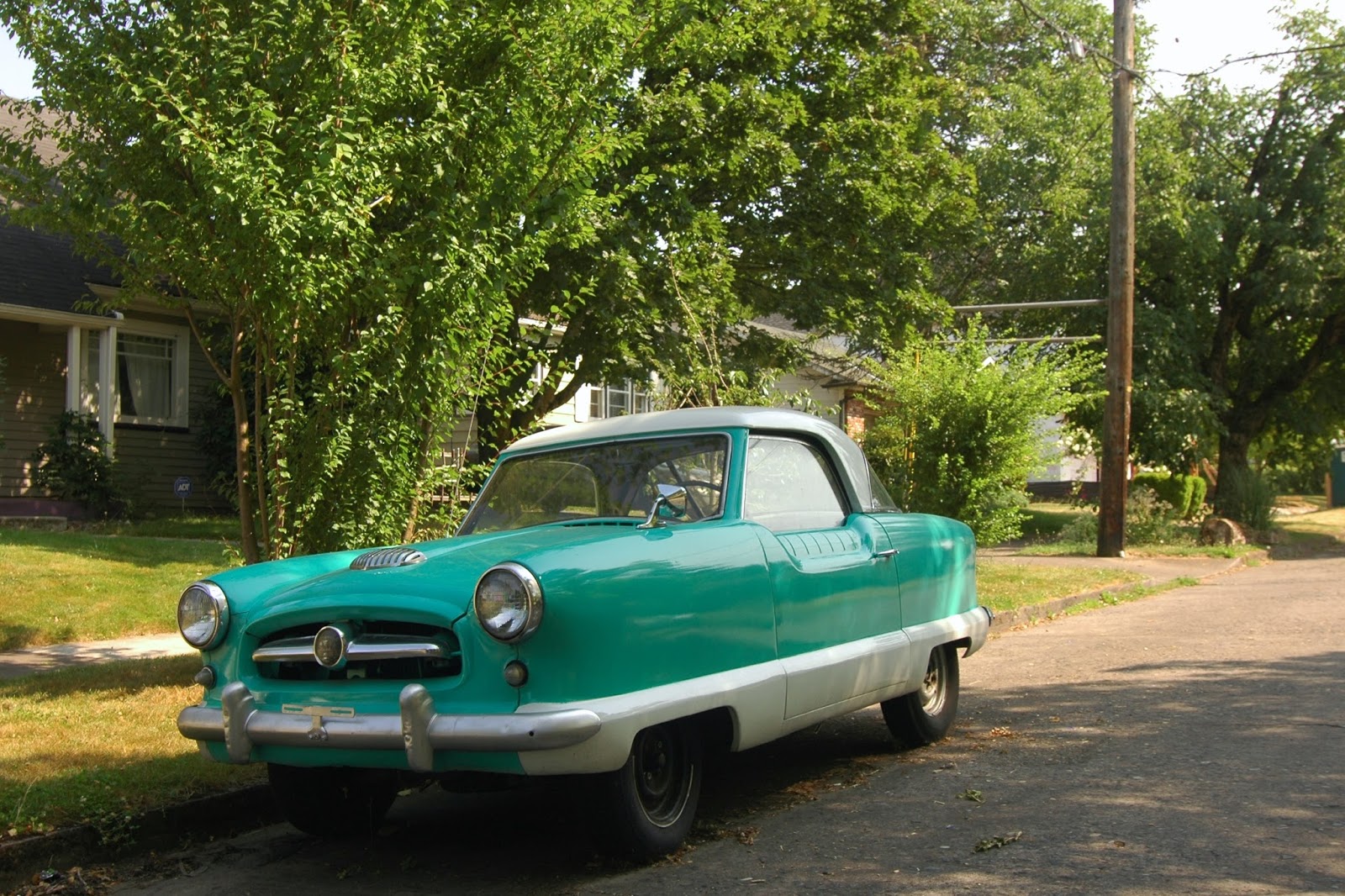 OLD PARKED CARS.: 1955 Nash Metropolitan.