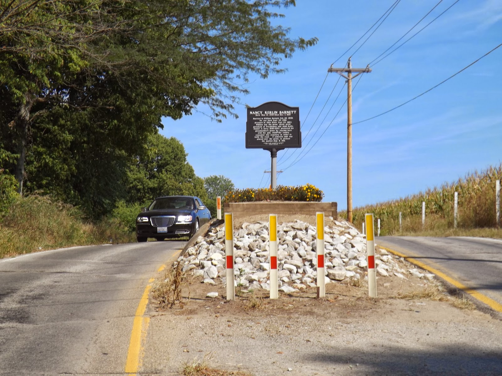A Grave Interest: A Grave in the Middle of the Road