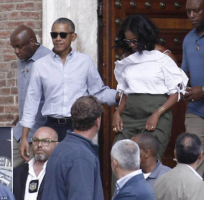 Michelle Obama bares shoulders and arms in flirty top and she and ...