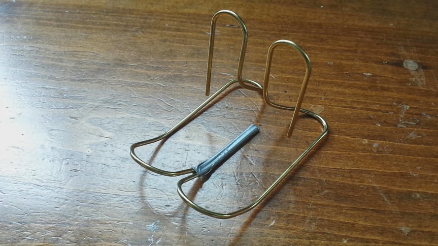 The Philadactyl: How to make a paperclip phone stand.