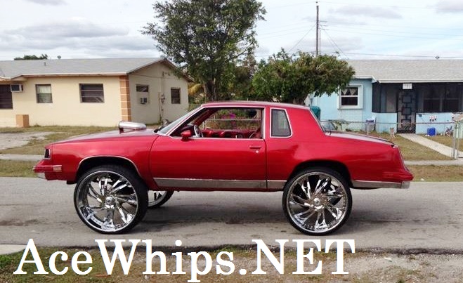 Ace-1: Candy Red Oldsmobile Cutlass on Brushed 32" Girato Forgiatos