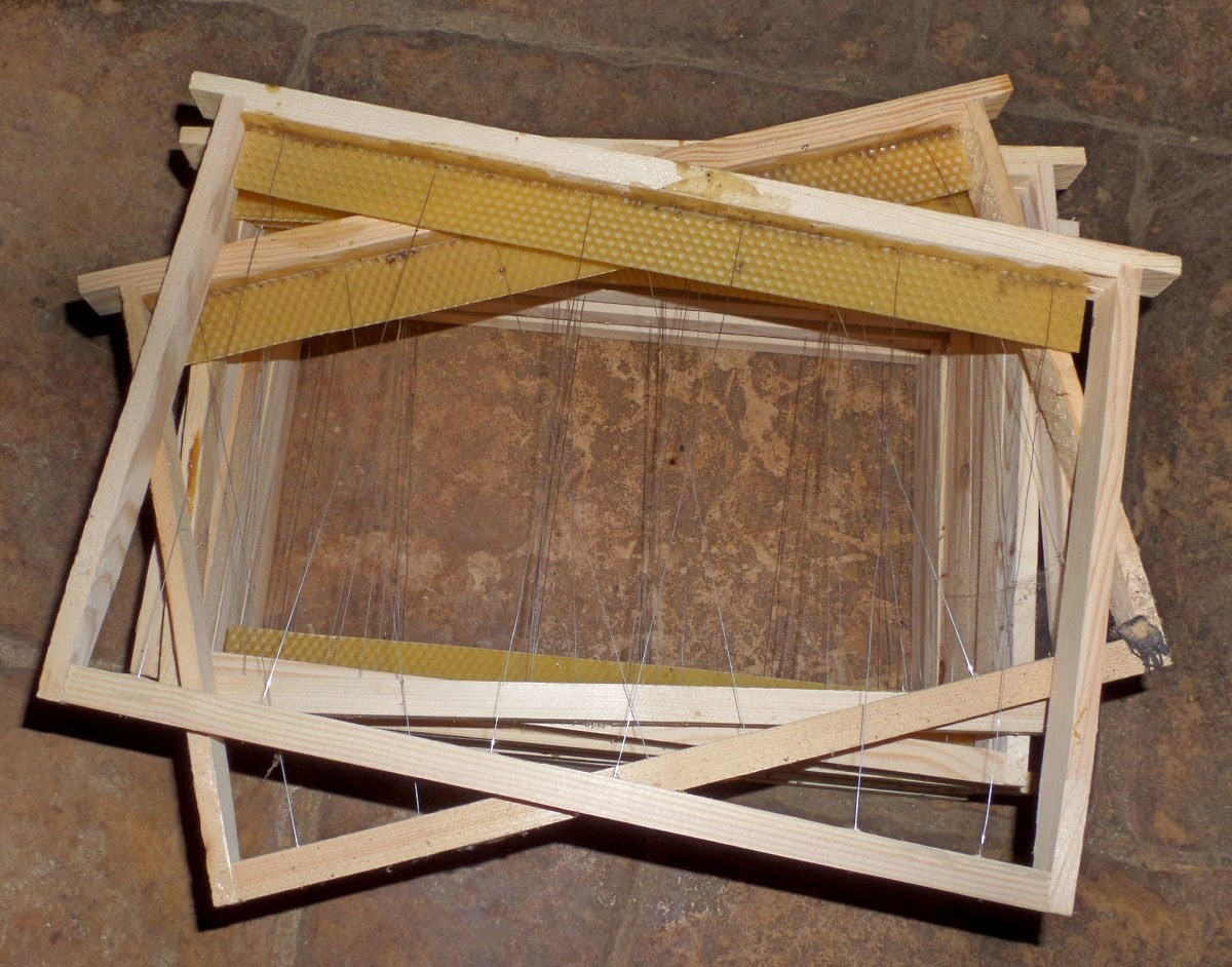French wildlife and beekeeping: Waxing frames for bee hives.