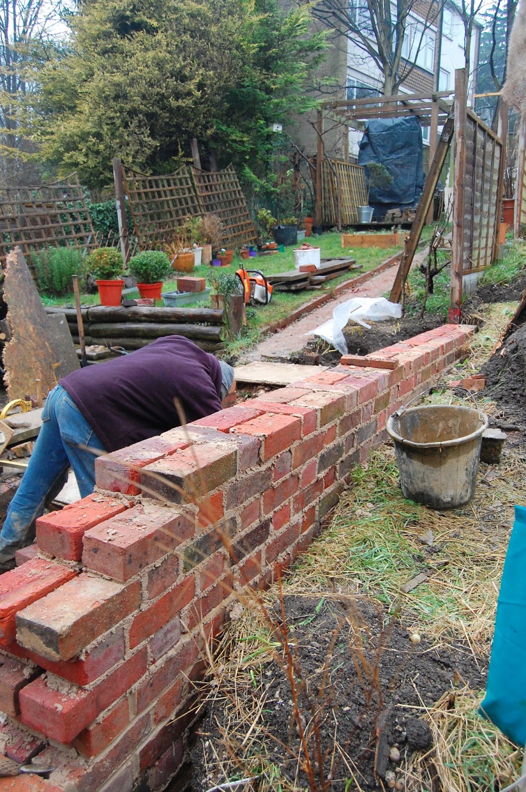 Higher brick piers and curved brick planters