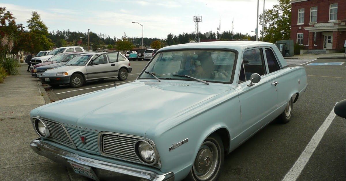 OLD PARKED CARS.: 1966 Plymouth Valiant 100.
