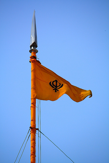 The Nishan Sahib - The sacred flag of the Sikhs, flown atop tall poles ...