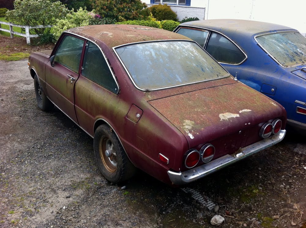 OLD PARKED CARS.: Mossy Mazda #2: Badgeless 1971 Mazda R100 Coupe.
