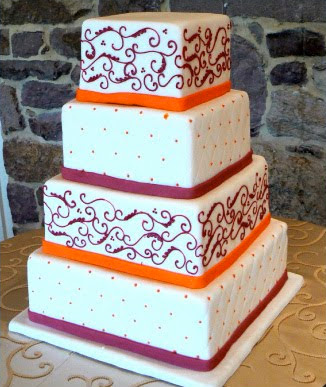 OohLaLa cakes: Multi-layer cake with purple and orange decorations