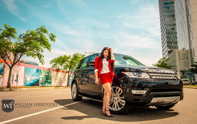 Rebellion office girl poses with Range Rover Sport | Carsfresh