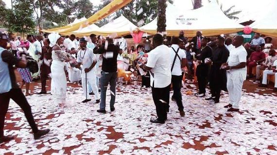 More pics from the lavish money spraying display at a wedding in Imo ...