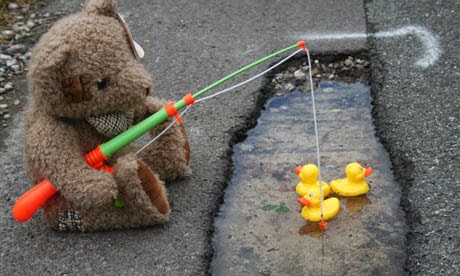 Mighty Lists: 13 creative pothole pictures