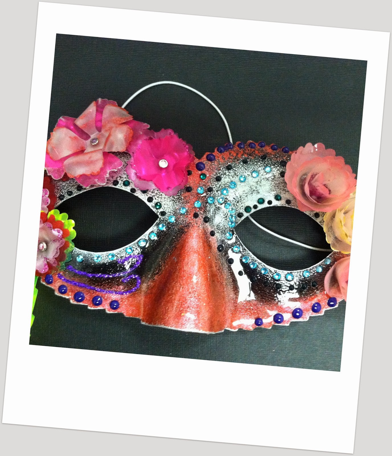 A Mask, Paint and Flowers...............