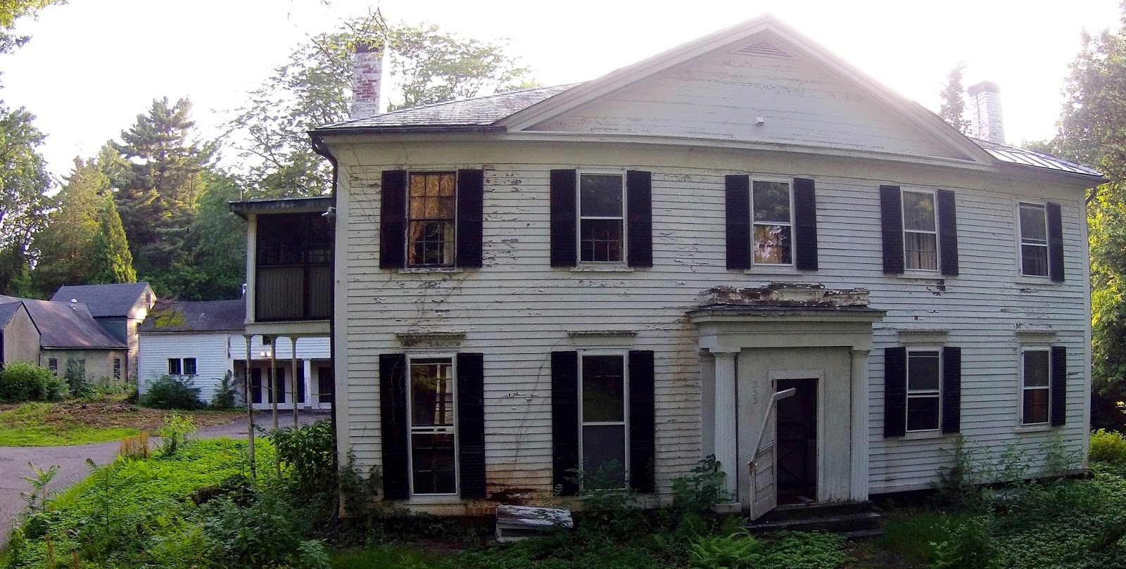 Only in The Republic of Amherst: Sad Tale Of Two Homes